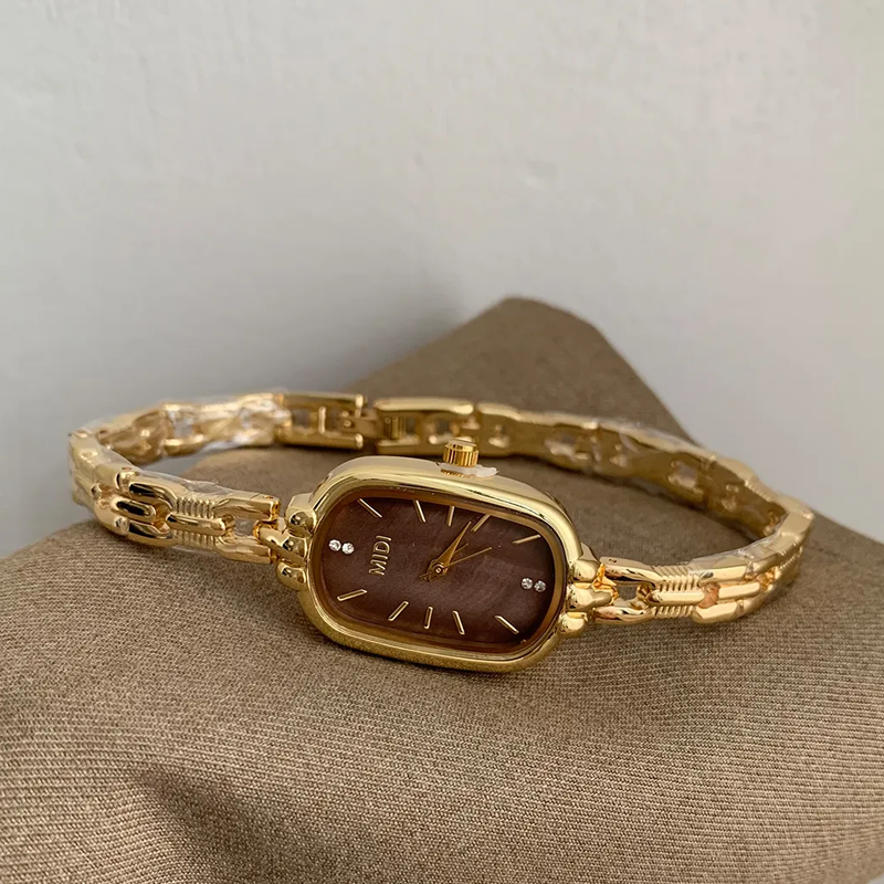 Golden Elegance Timepiece: Oval Coffee Dial Watch – MTG
